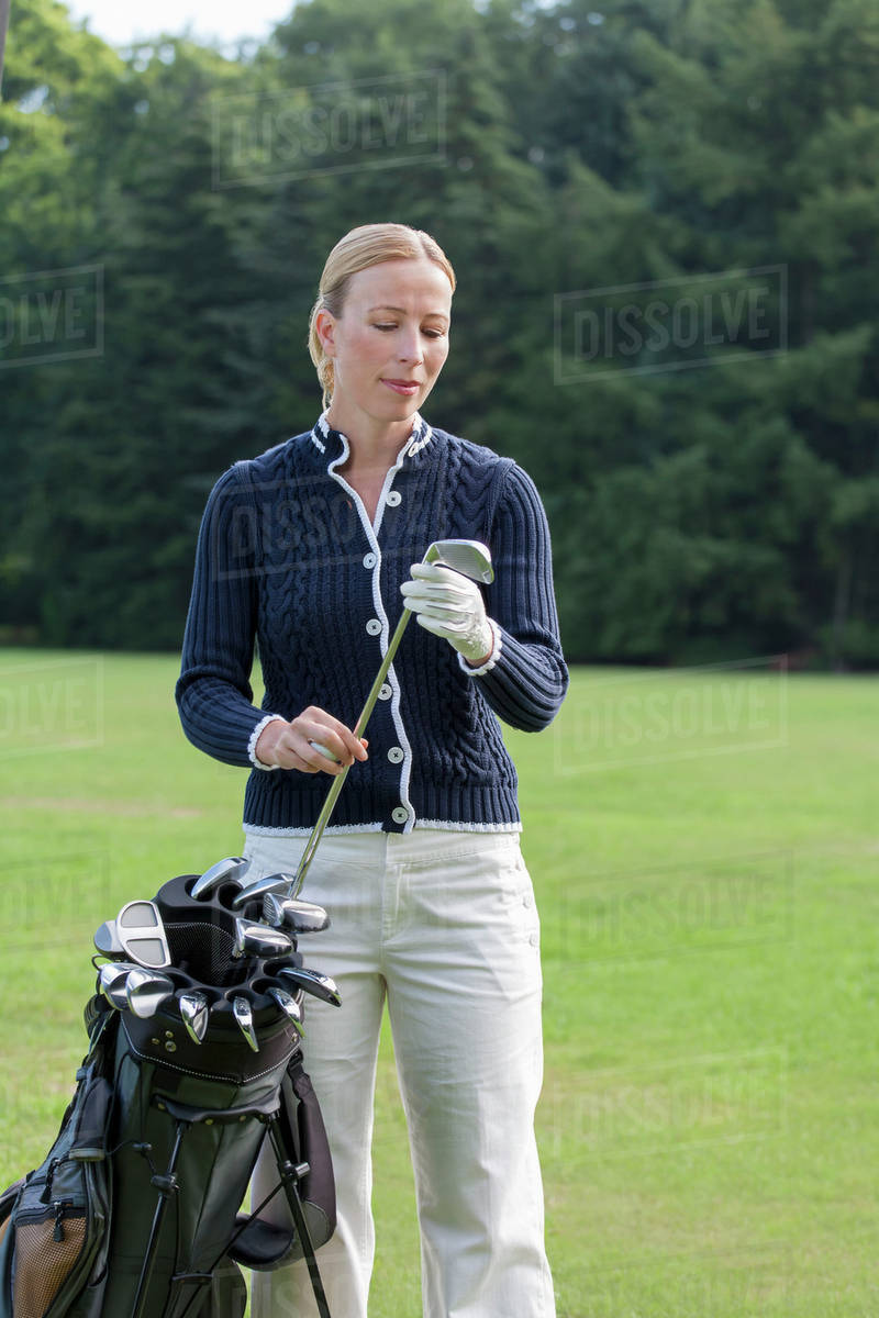Woman on golf course - Royalty-free Stock Photo | Dissolve