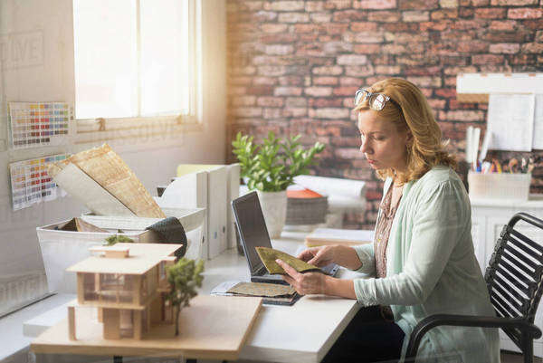 Female interior designer at work - Royalty-free Stock Photo | Dissolve