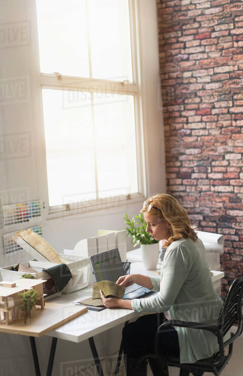 Female interior designer at work - Stock Photo - Dissolve