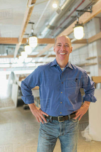 Portrait of smiling business owner - Royalty-free Stock Photo | Dissolve