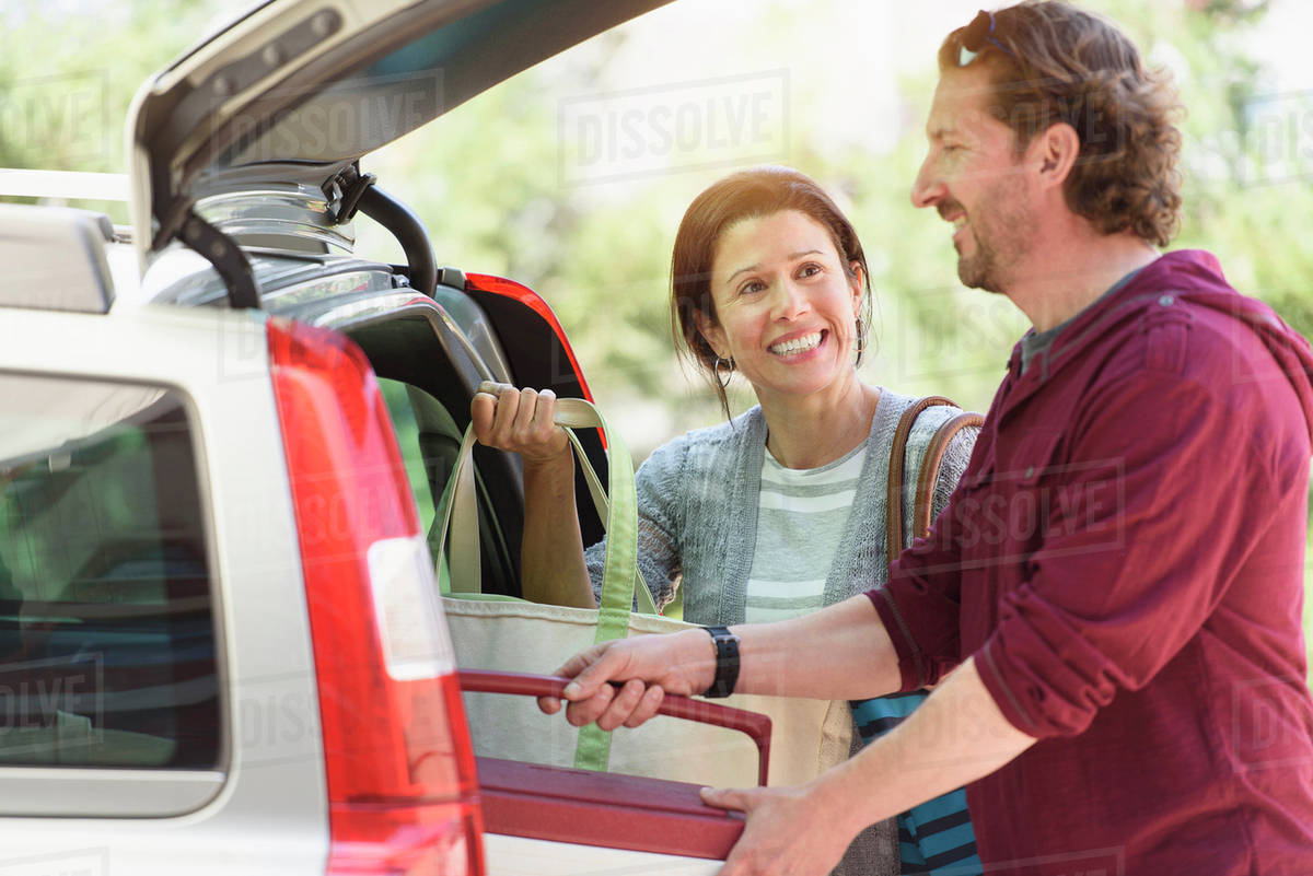 Couple packing their car - Royalty-free Stock Photo | Dissolve