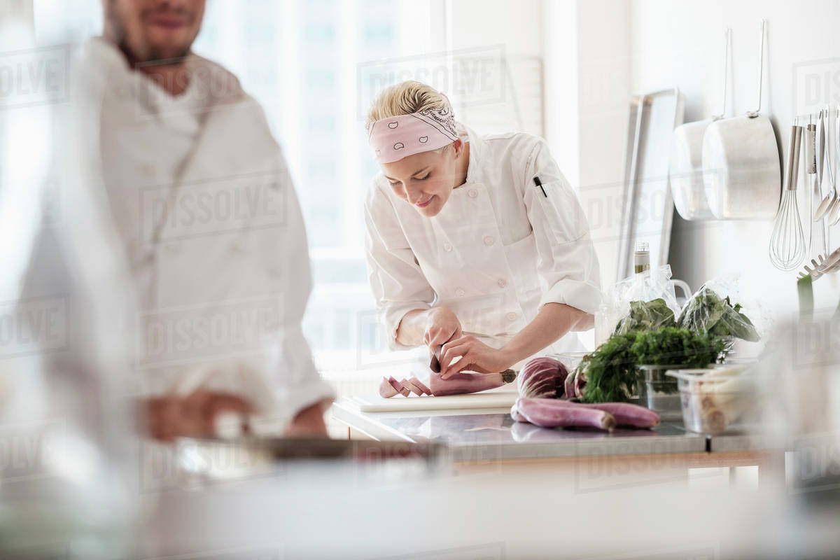 Chefs working in kitchen - Royalty-free Stock Photo | Dissolve