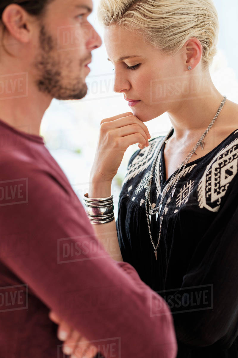 Couple arguing in living room - Royalty-free Stock Photo | Dissolve