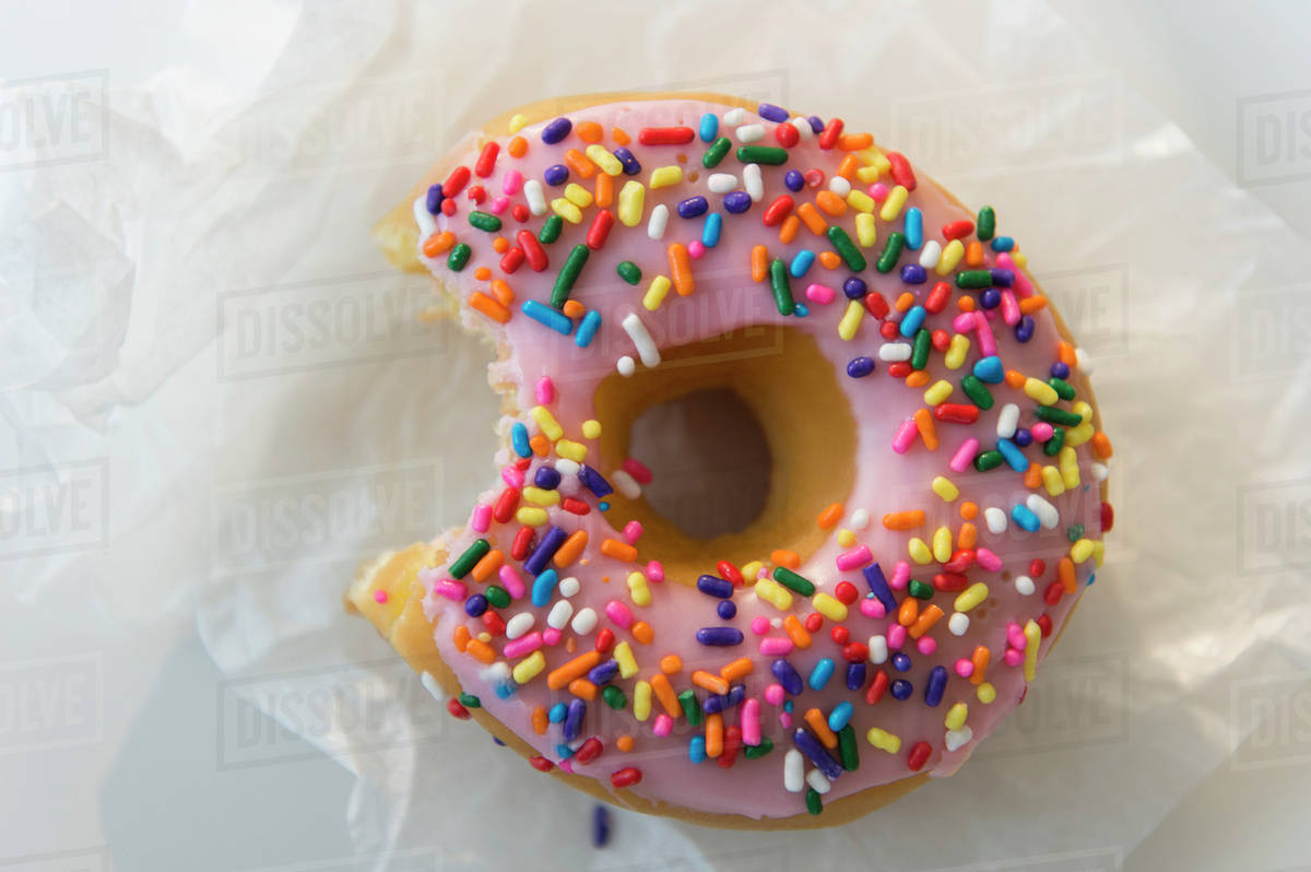 Bite taken out of donut - Royalty-free Stock Photo | Dissolve