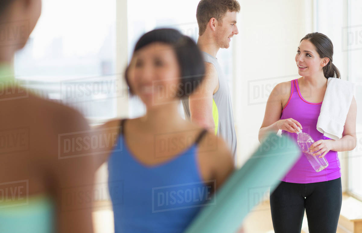 People talking in gym - Royalty-free Stock Photo | Dissolve