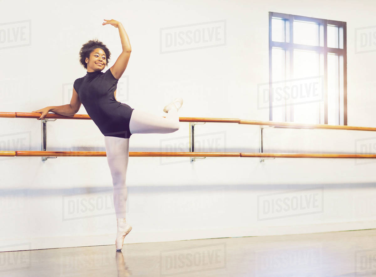 Young woman dancing in dance studio - Royalty-free Stock Photo | Dissolve