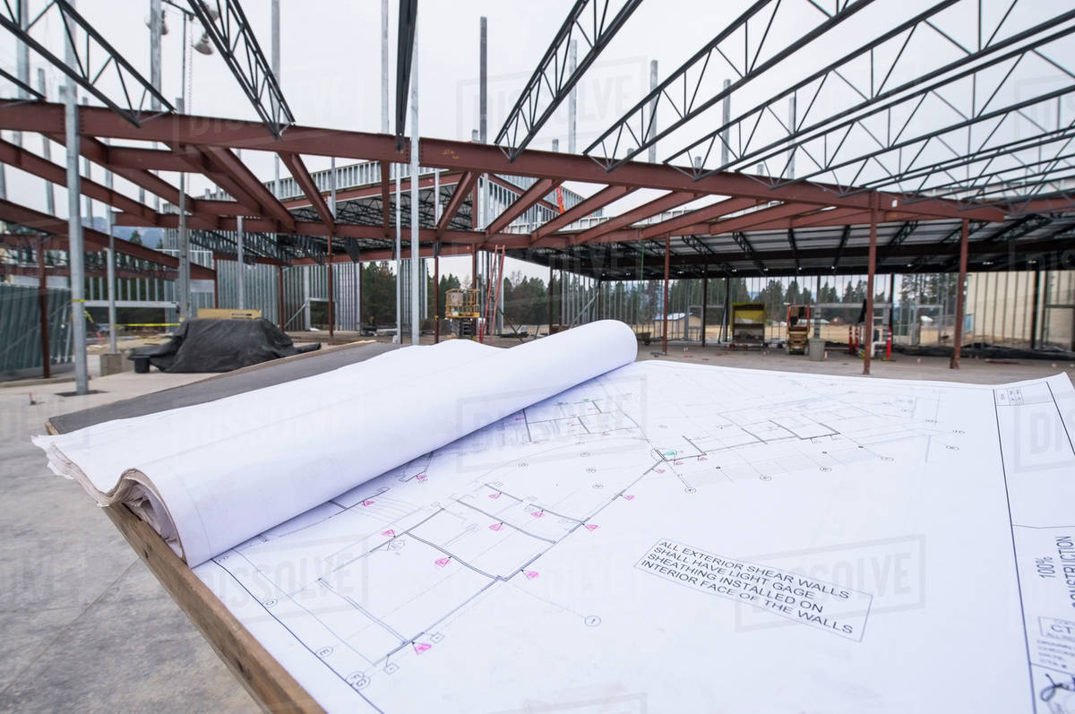 Architectual plans on table - Royalty-free Stock Photo | Dissolve