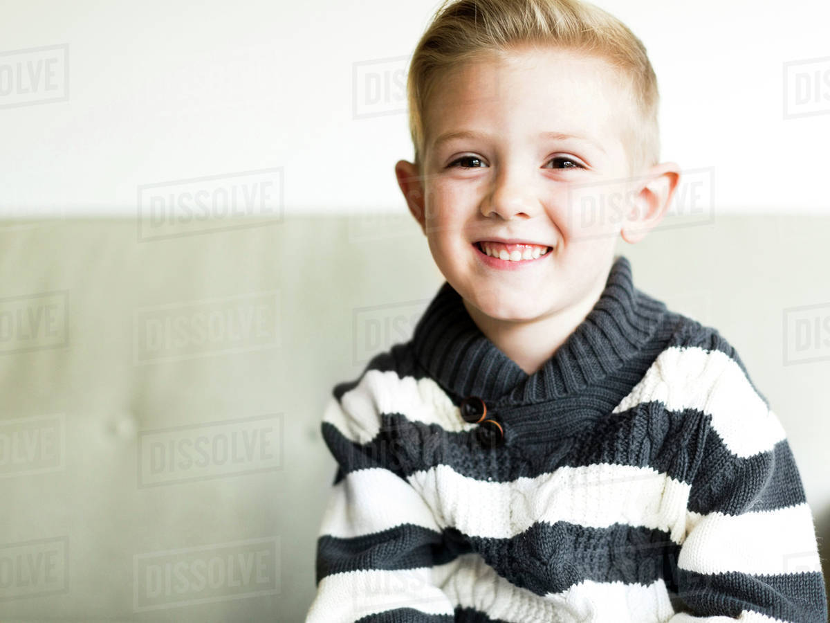 Portrait of smiling boy (6-7) - Stock Photo - Dissolve