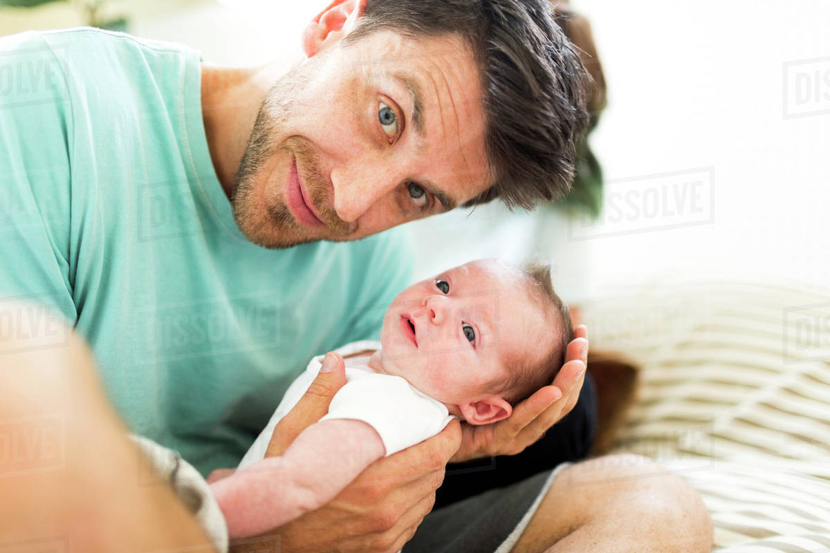 Portrait of man with baby boy (6-11 months) - Royalty-free Stock Photo ...