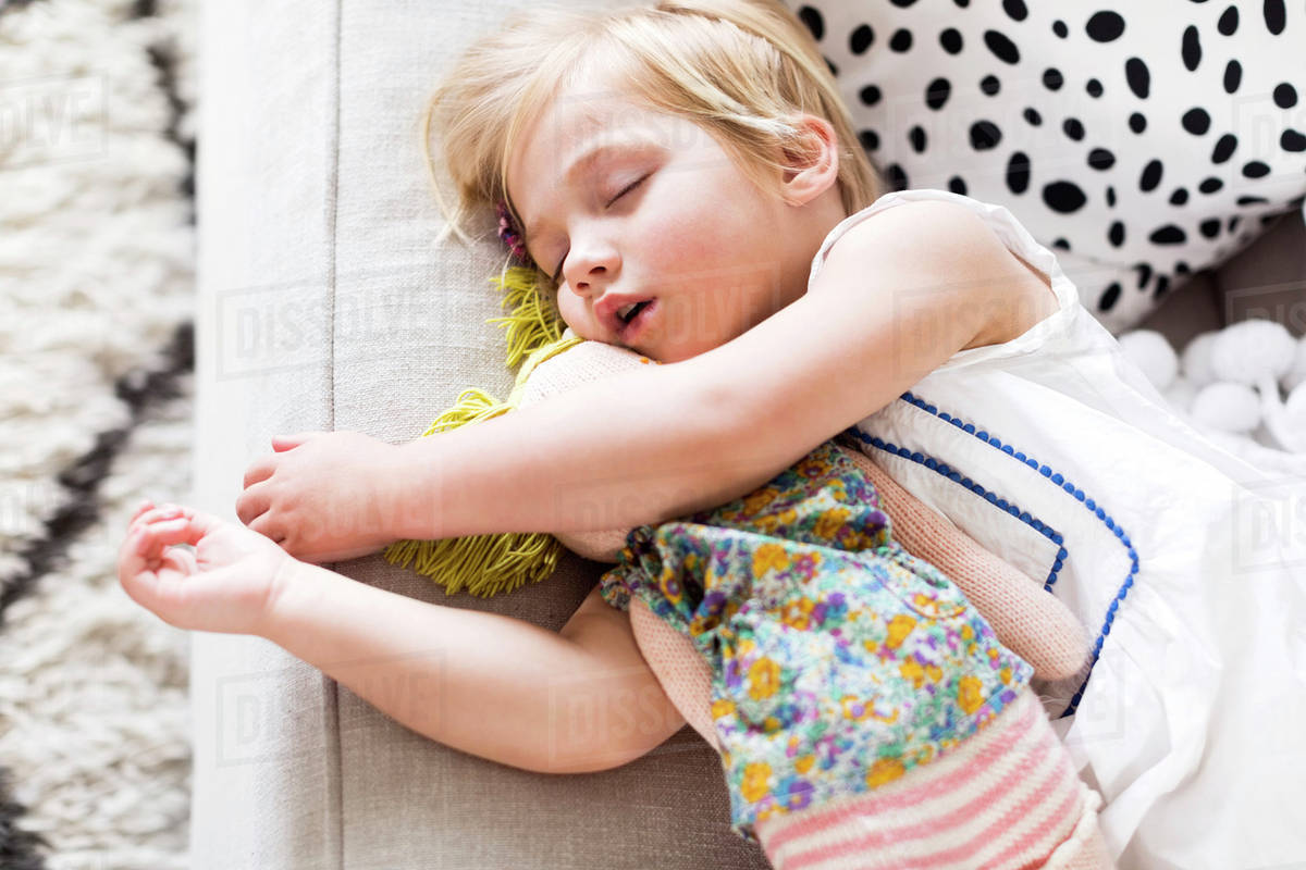 Girl (2-3) napping on sofa - Royalty-free Stock Photo | Dissolve