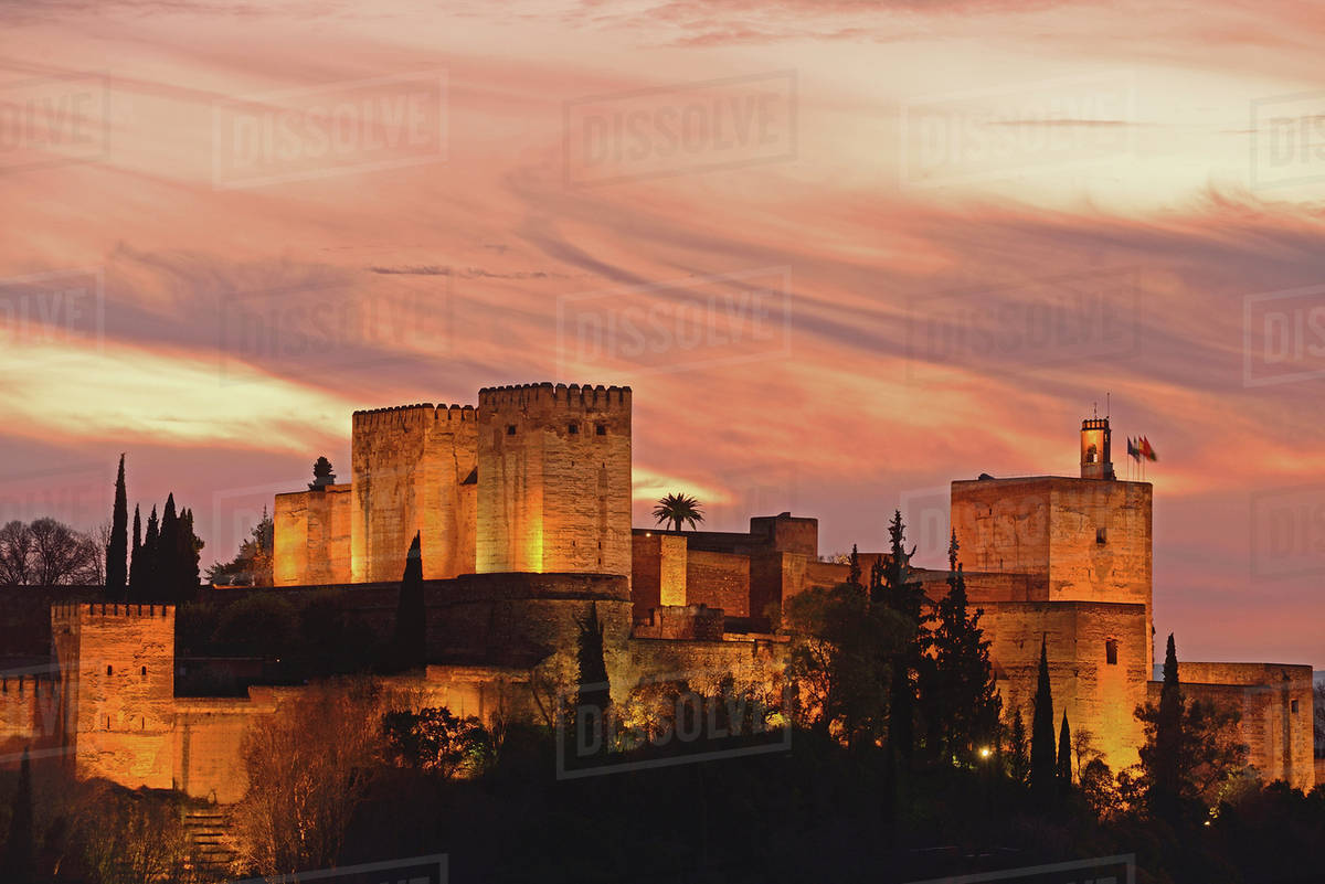 Illuminated castle at dusk, pastel colored clouds in sky - Stock Photo ...
