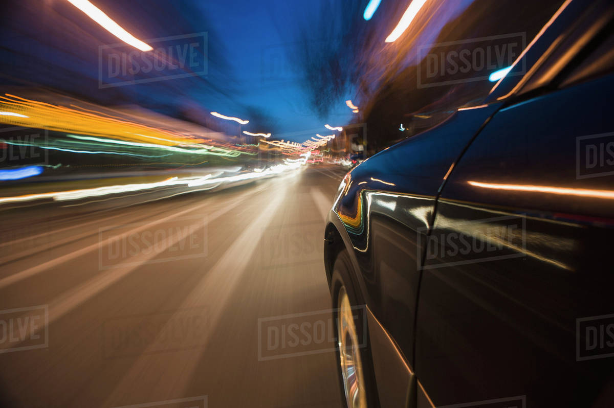 Car speeding through street - Royalty-free Stock Photo | Dissolve