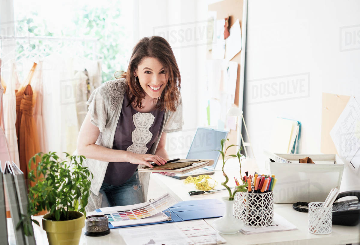 Female fashion designer in her office - Stock Photo - Dissolve