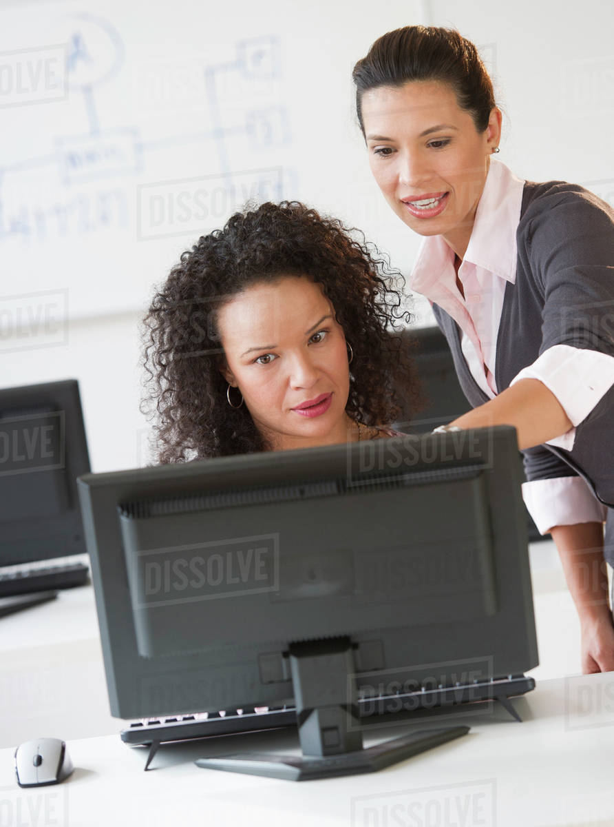 Business women using computer in office - Royalty-free Stock Photo ...