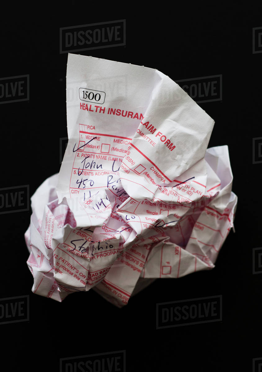 Studio shot of crumpled document - Royalty-free Stock Photo | Dissolve