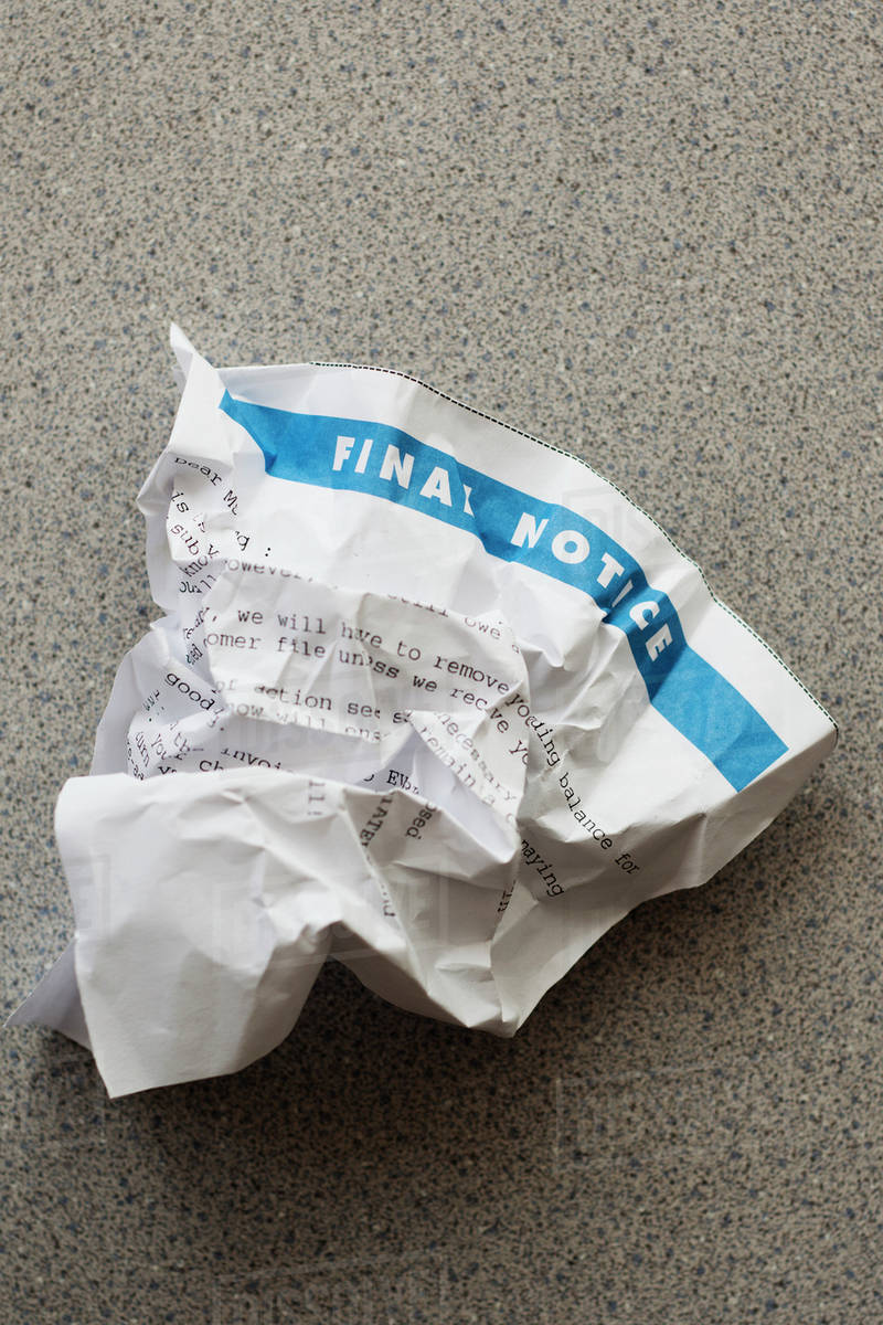 Studio shot of crumpled document - Stock Photo - Dissolve