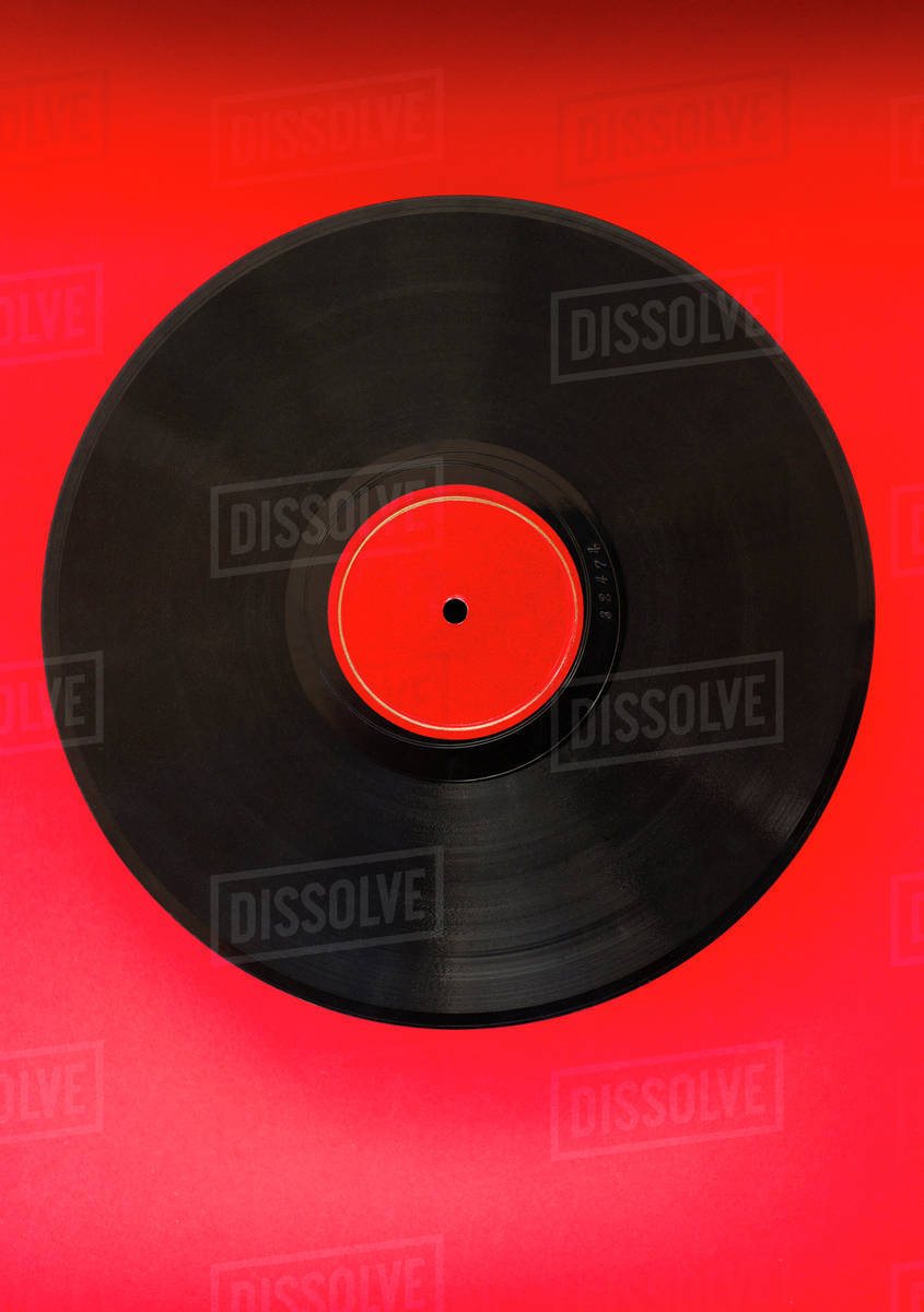 Vinyl record in on red background, studio shot - Royalty-free Stock ...