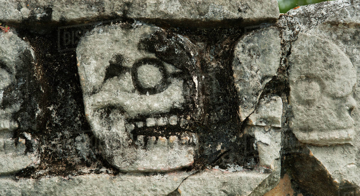 Mayan carvings representing human skulls - Stock Photo - Dissolve