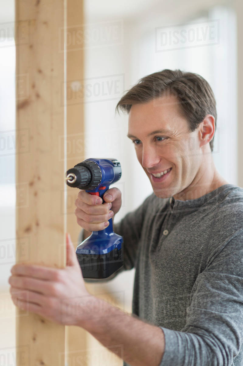 Man using hand drill - Royalty-free Stock Photo | Dissolve