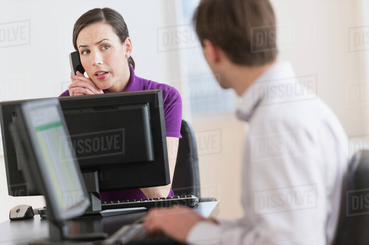 Office workers using computers - Royalty-free Stock Photo | Dissolve
