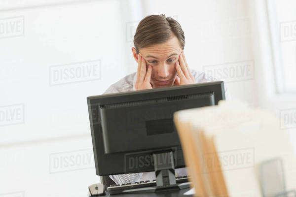 Office worker using computer - Royalty-free Stock Photo | Dissolve