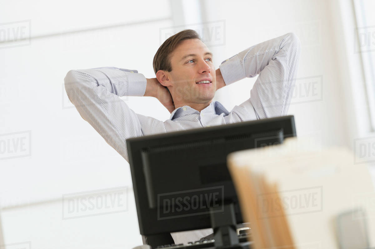 Office worker using computer - Royalty-free Stock Photo | Dissolve