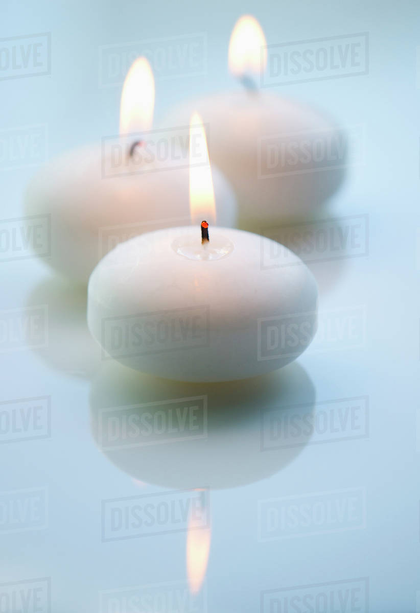 Studio shot of white candles - Royalty-free Stock Photo | Dissolve