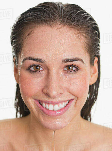 Studio portrait of woman with wet face - Royalty-free Stock Photo ...