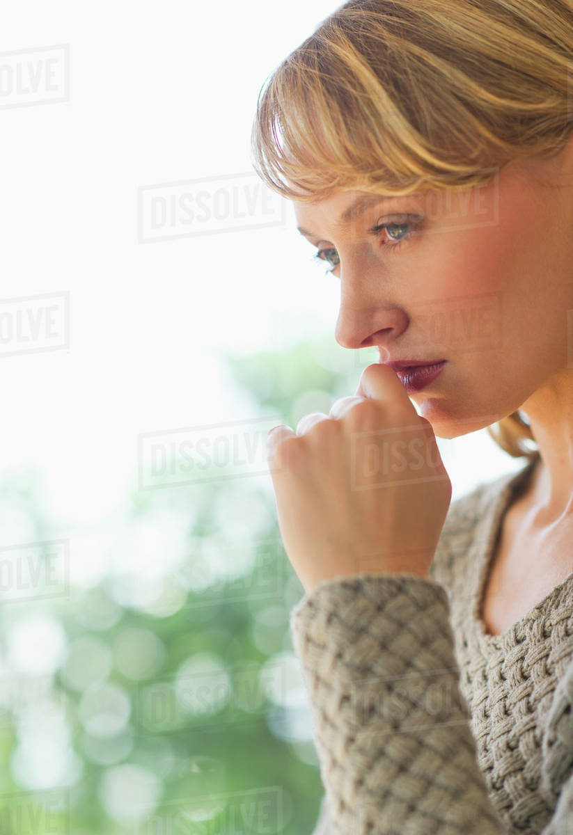 Portrait of woman contemplating - Royalty-free Stock Photo | Dissolve
