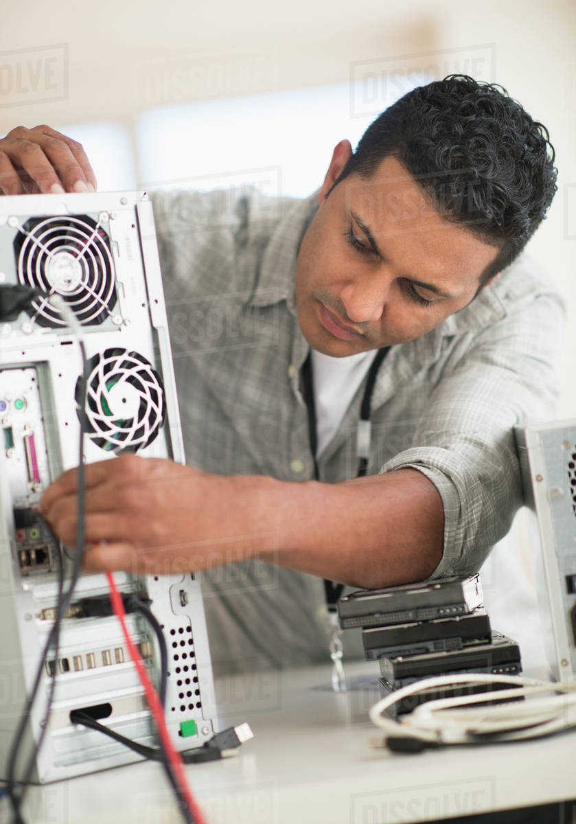 Man repairing computer - Royalty-free Stock Photo | Dissolve