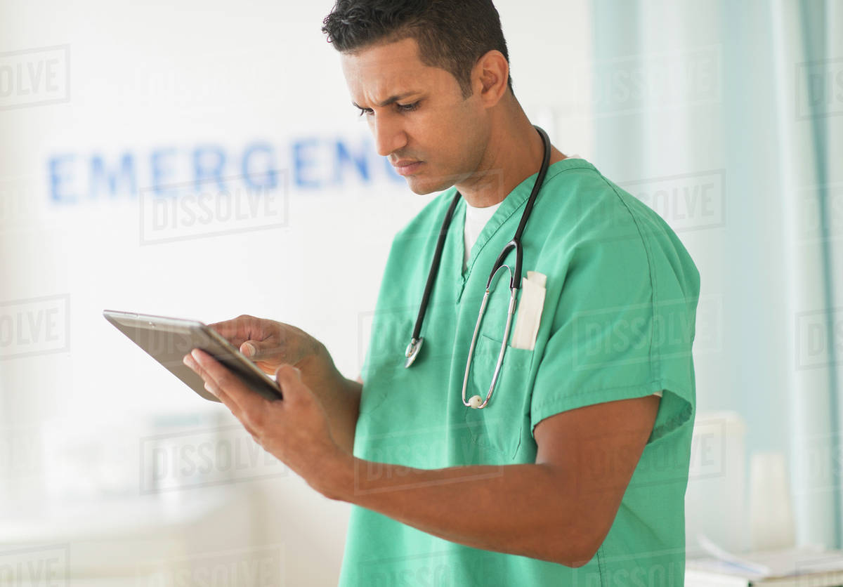 Doctor using digital tablet - Royalty-free Stock Photo | Dissolve