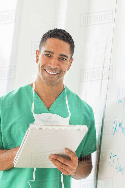 Portrait of male surgeon with medical chart in hospital - Stock Photo ...