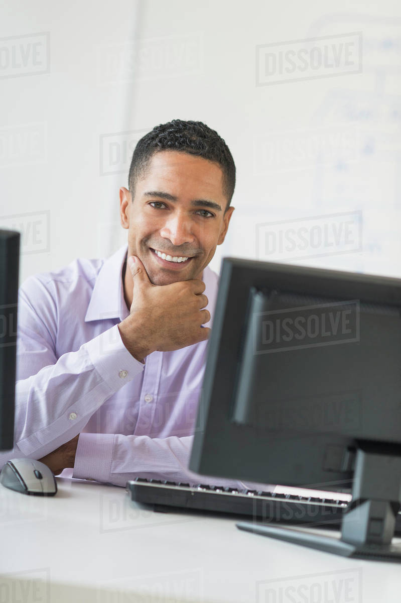 Portrait of male business executive at desk - Royalty-free Stock Photo ...