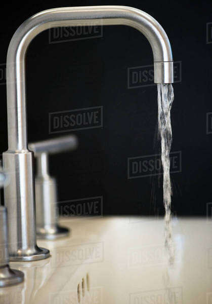 Water flowing from faucet - Stock Photo - Dissolve