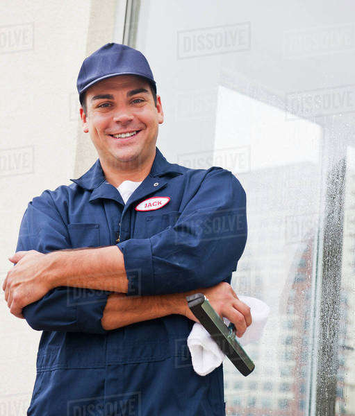 Man cleaning window - Stock Photo - Dissolve