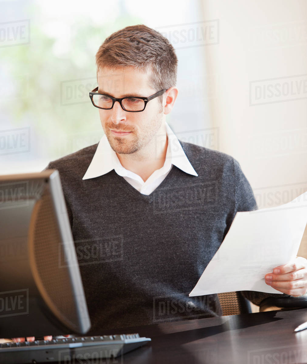 Portrait of man in office - Stock Photo - Dissolve