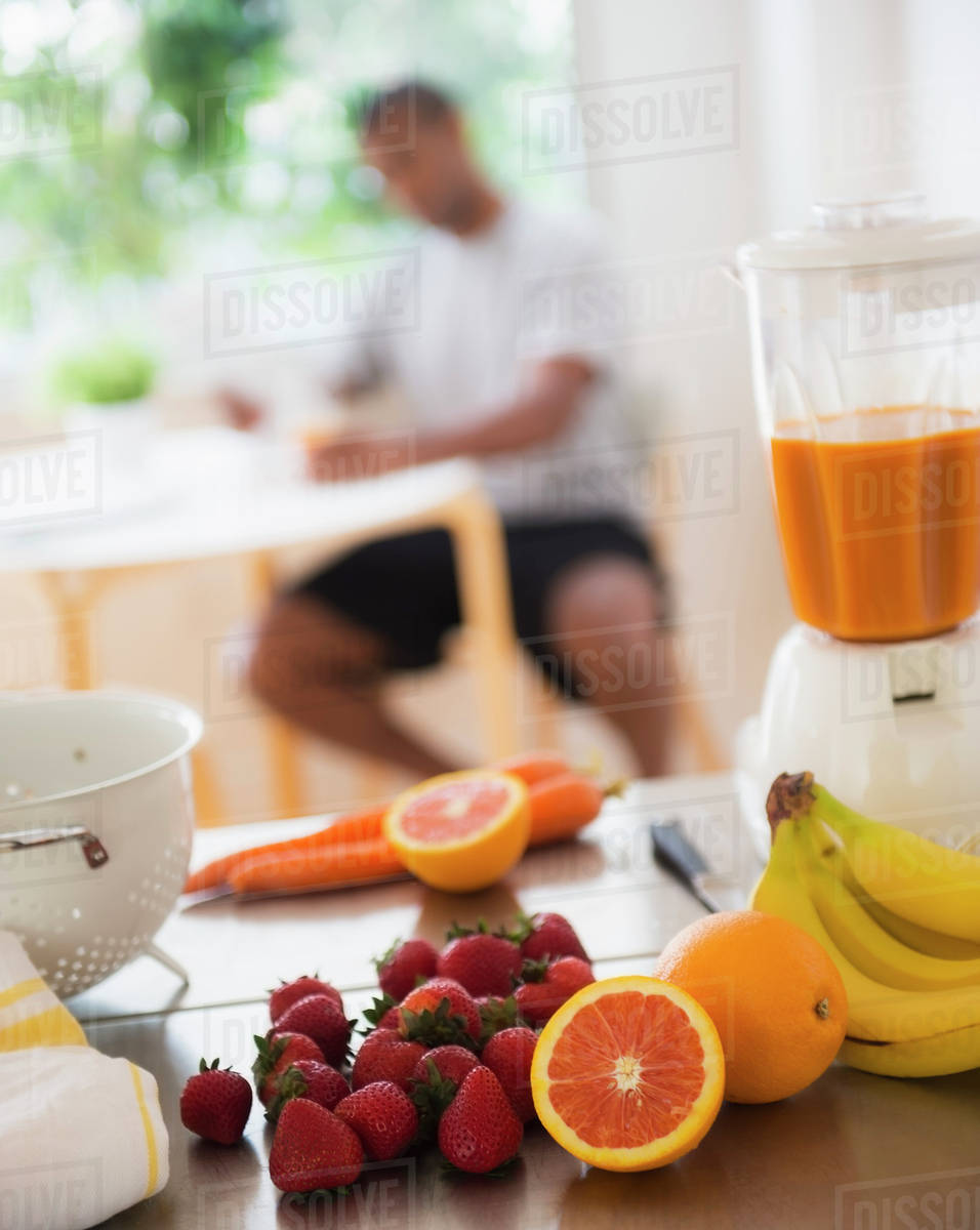 Kitchen table with fresh fruits - Stock Photo - Dissolve