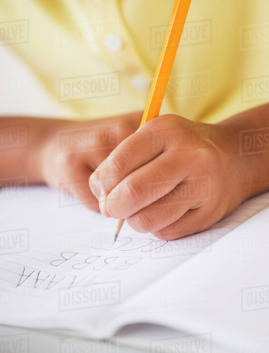 Girl (6-7) doing homework, close-up of hands - Royalty-free Stock Photo ...