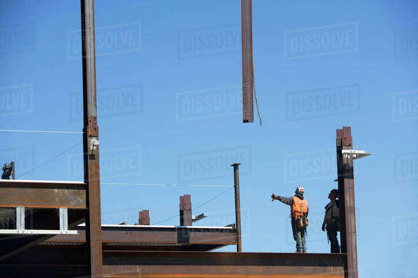 Construction workers on construction frame - Royalty-free Stock Photo ...