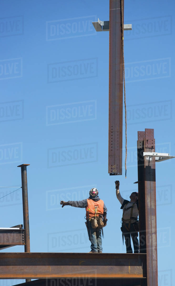 Construction workers on construction frame - Royalty-free Stock Photo ...