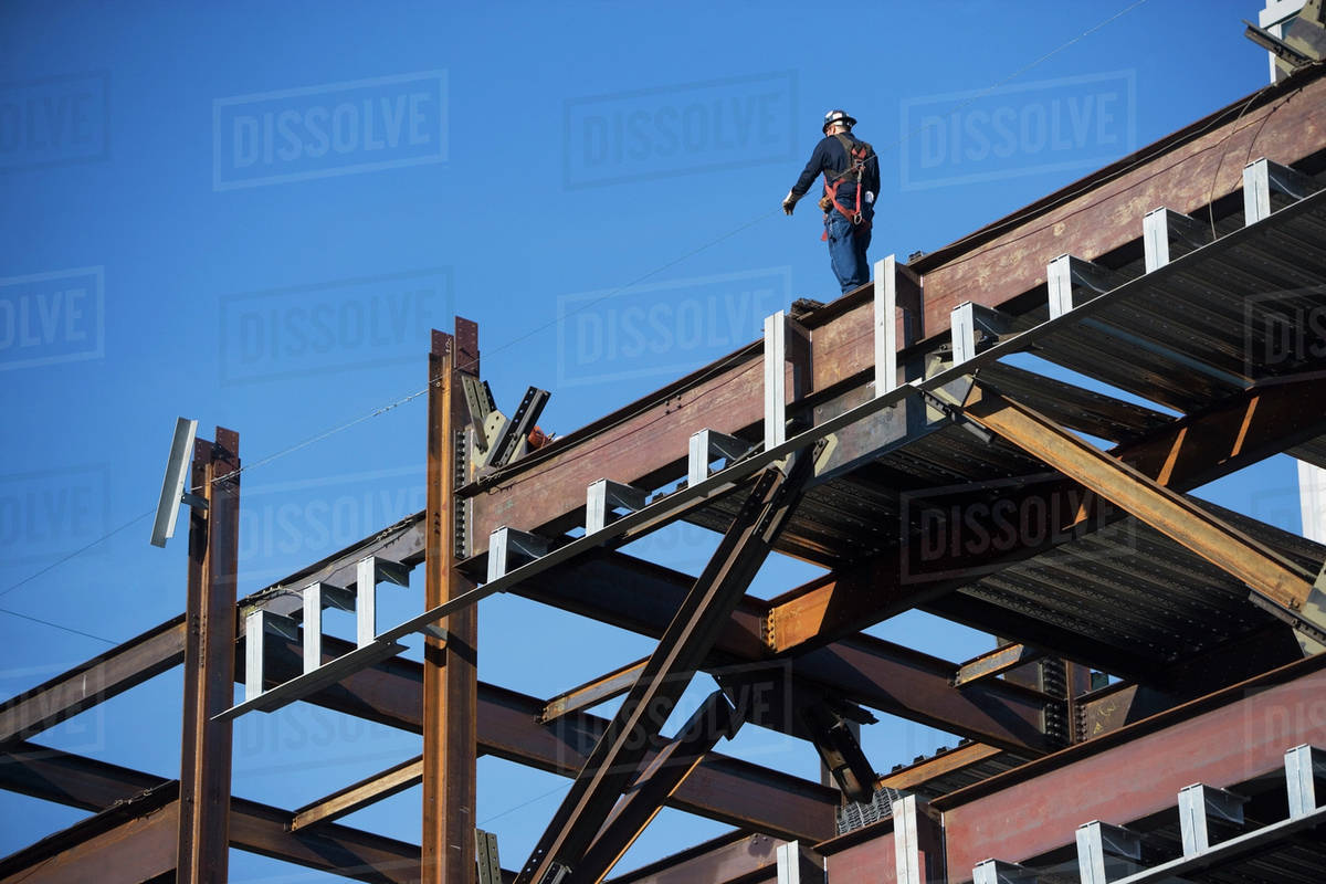 Construction worker on construction frame - Royalty-free Stock Photo ...