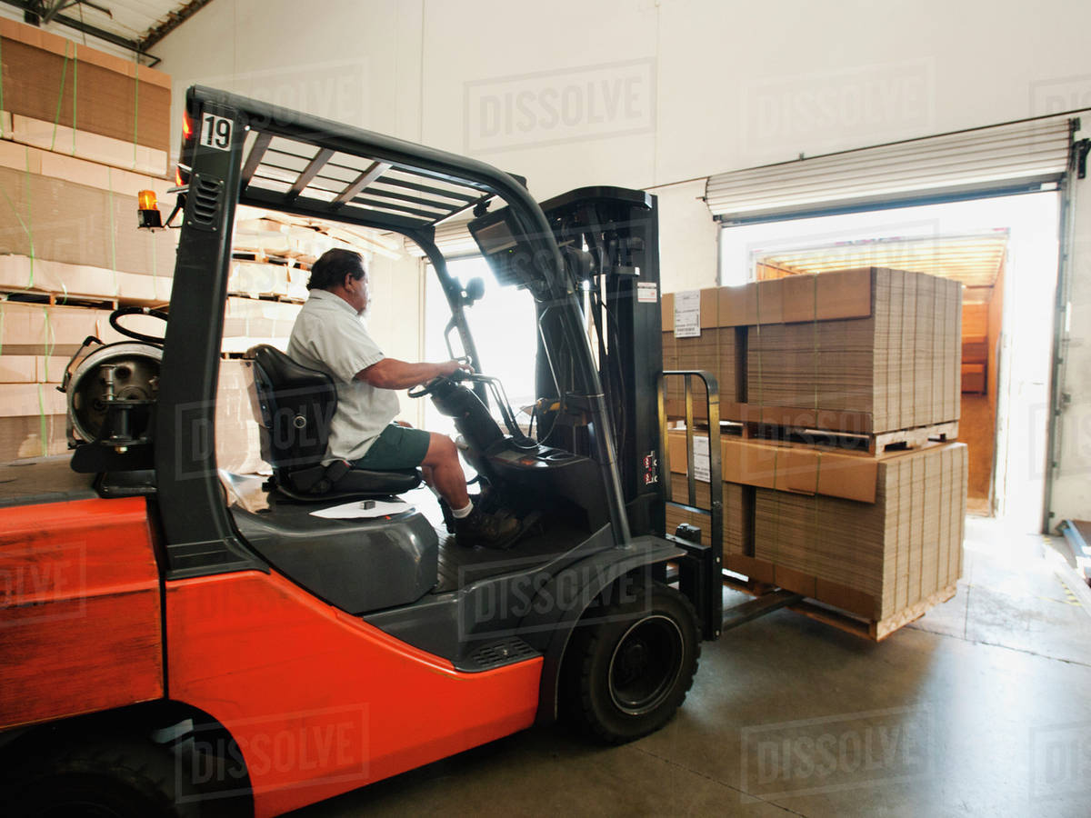 Forklift truck loading pallets into trailer - Royalty-free Stock Photo ...