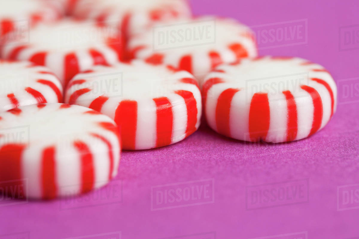 Red and white candies, studio shot - Royalty-free Stock Photo | Dissolve