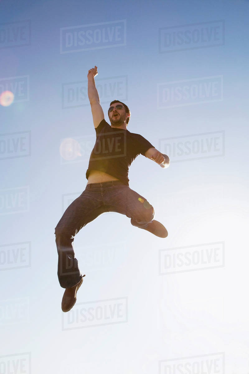 Man jumping in air - Royalty-free Stock Photo | Dissolve
