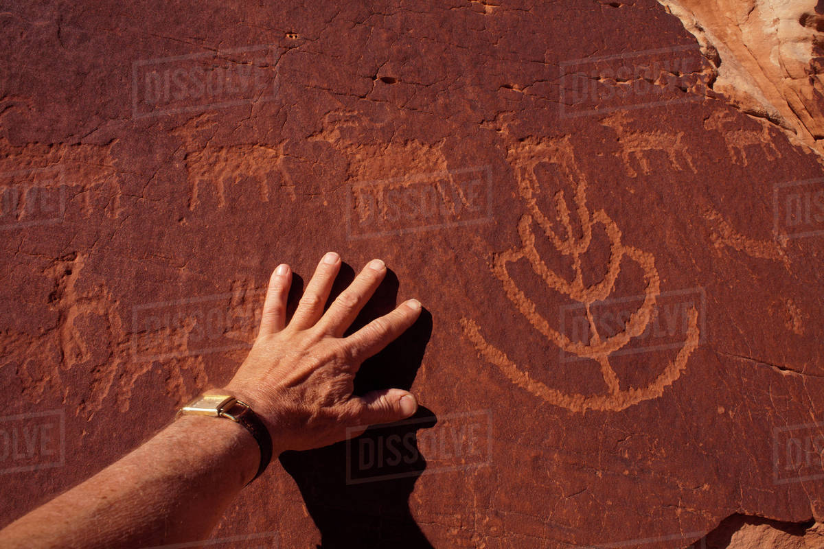 USA, Utah, Native American art on stone wall - Stock Photo - Dissolve
