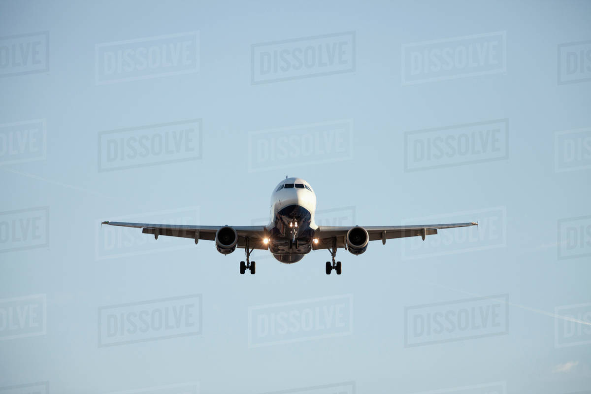 Commercial jet airliner flying towards camera - Stock Photo - Dissolve