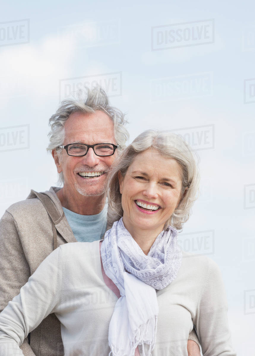 Portrait of senior smiling outdoors - Stock Photo - Dissolve