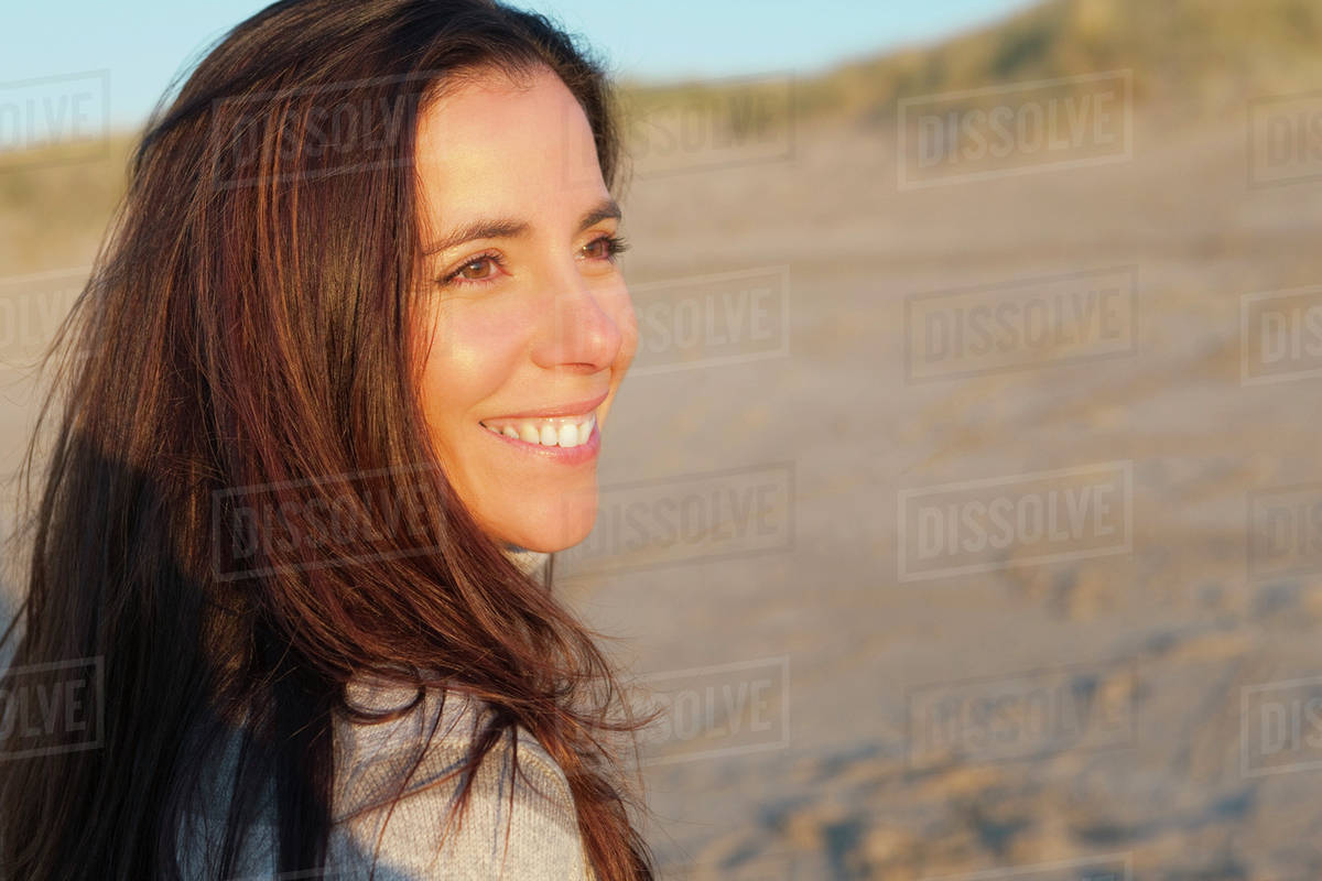 Portrait of smiling woman - Stock Photo - Dissolve