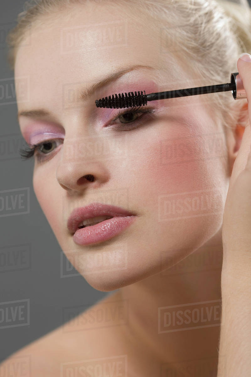 Beauty portrait of woman using mascara - Royalty-free Stock Photo ...