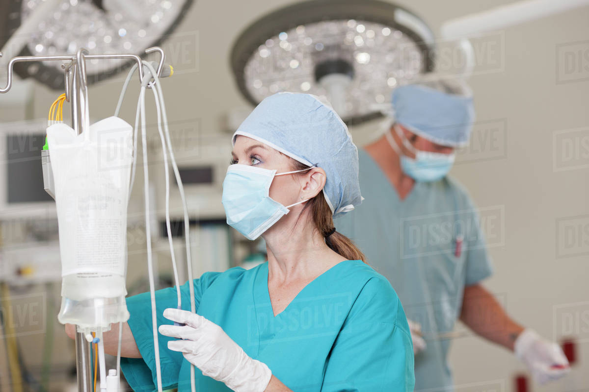Surgeons getting ready for surgery - Royalty-free Stock Photo | Dissolve
